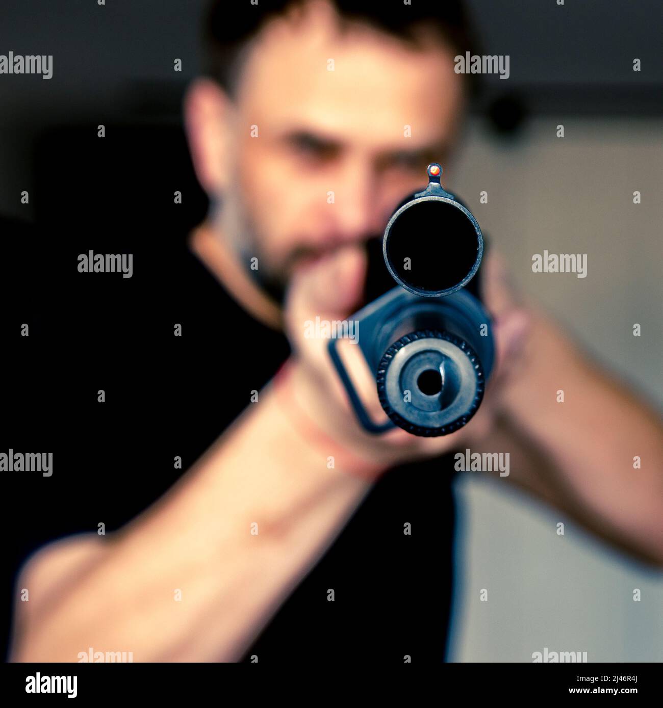 man holding a hunting rifle with a sight. Self-defense. Protection of ...