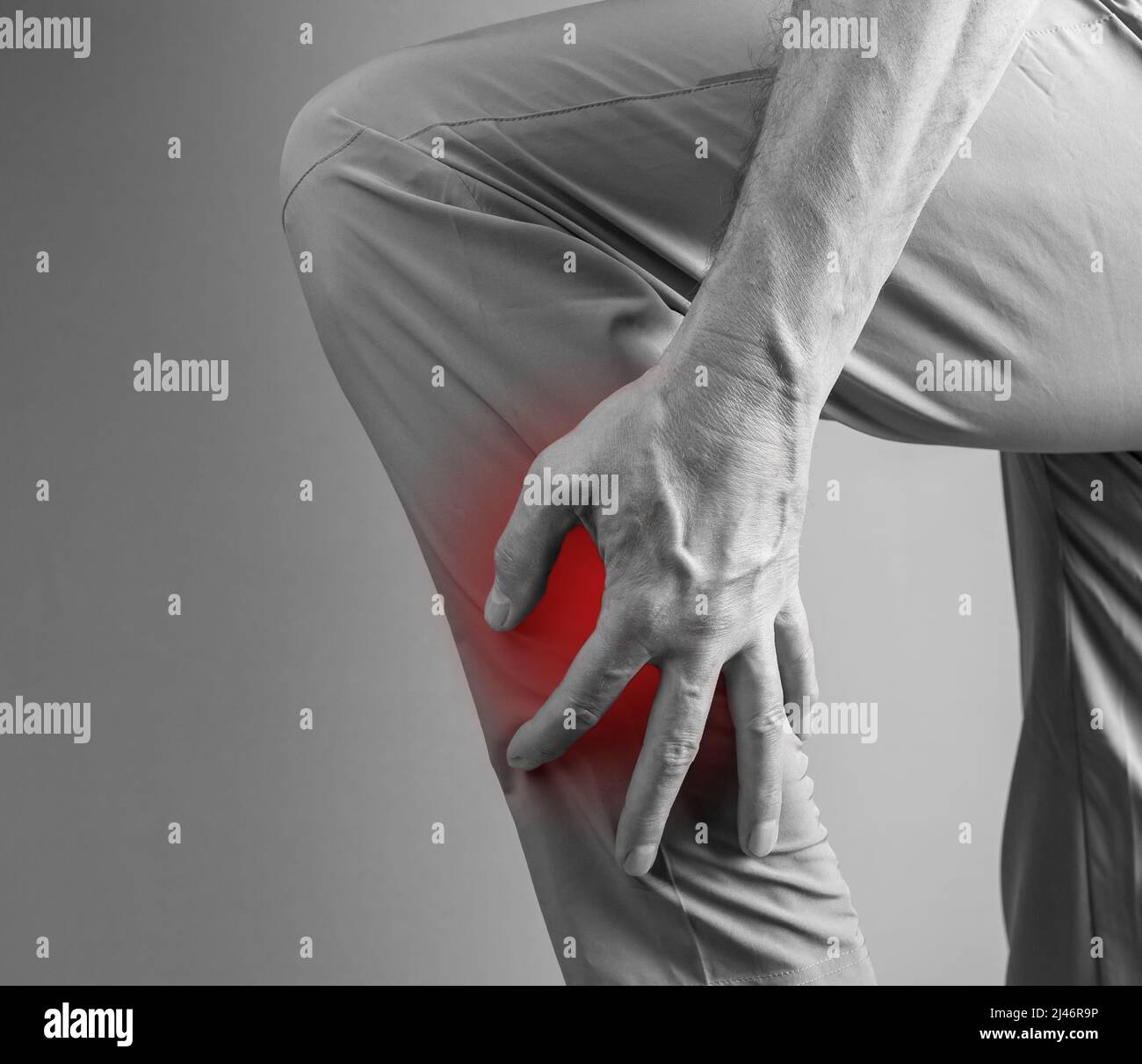 Shin splints. Man holding painful leg with red spot closeup. Overuse ...