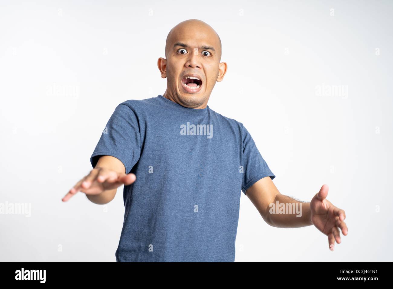 scared bald man with bulging eyes expression Stock Photo - Alamy