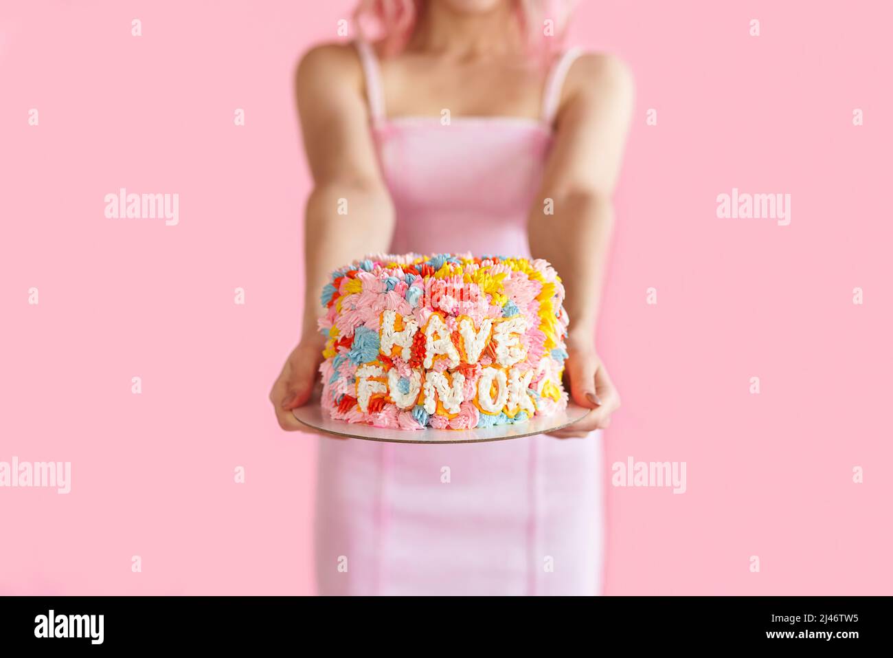 birthday cake design in woman hands on the pink background Stock Photo ...