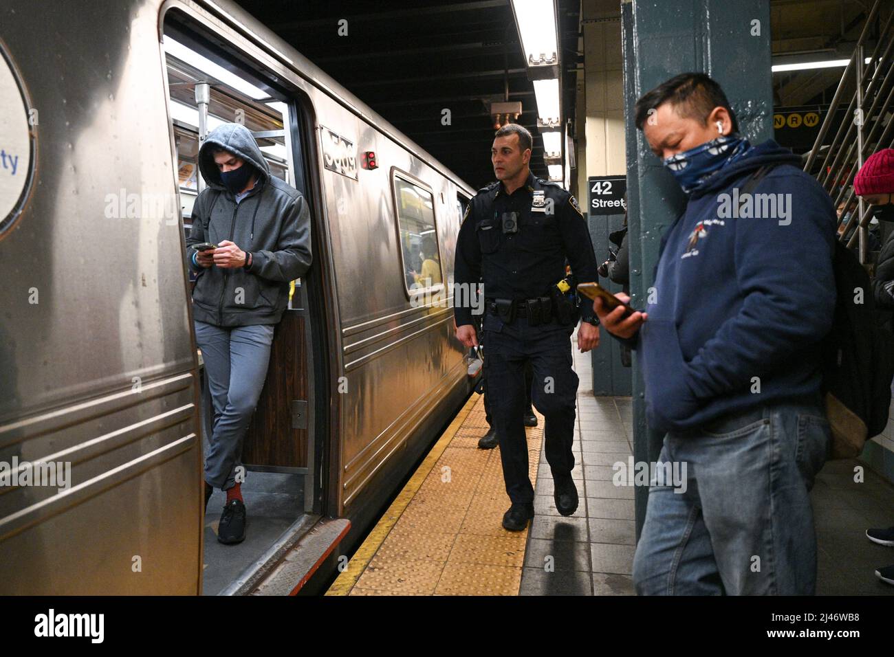 Police officers patrol the subway platform at 42nd Street-Times Square ...