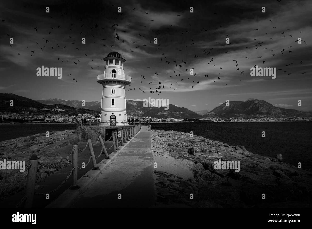 Old lighthouse in the port Stock Photo - Alamy