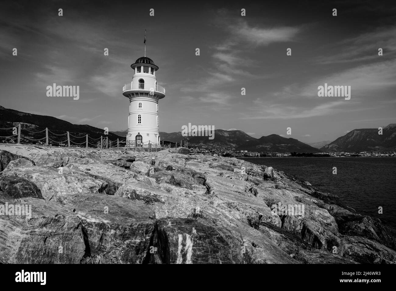 Old lighthouse in the port Stock Photo - Alamy