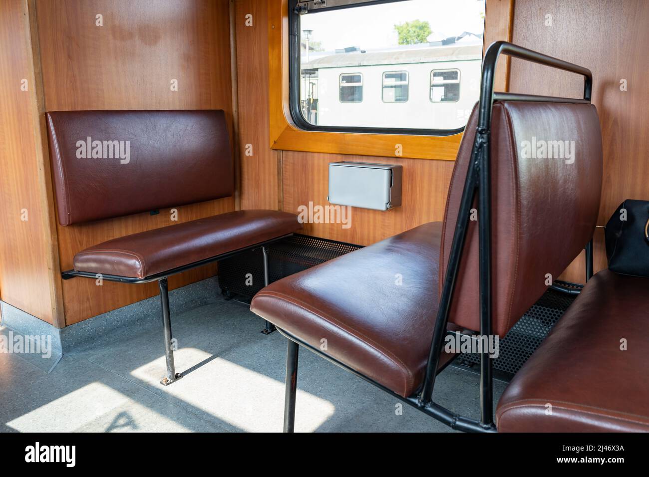 Seat in an old retro railcar of the SDG Lößnitzgrundbahn. Interior of a ...