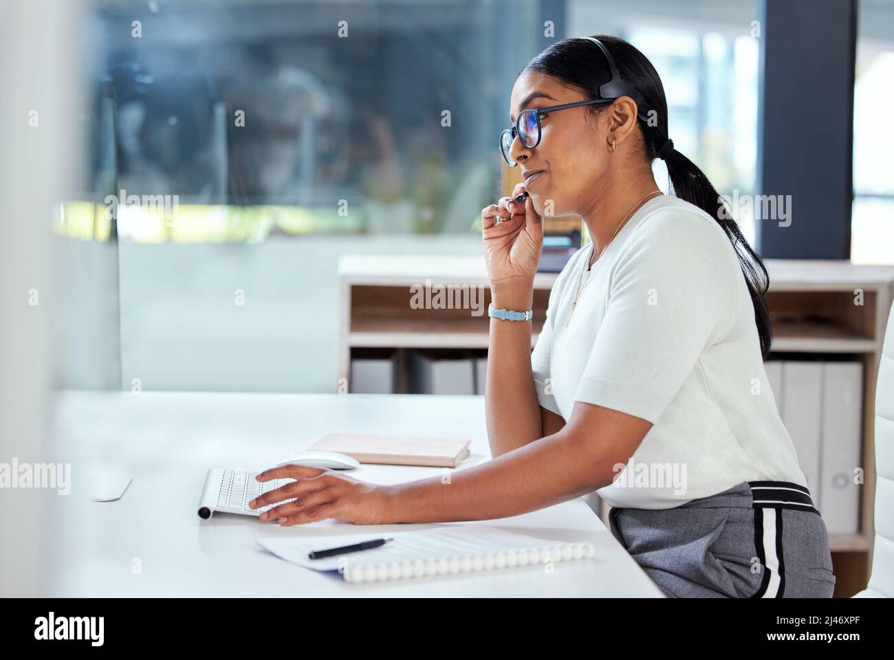 Hello, how can I help you. Shot of an attractive young businesswoman ...