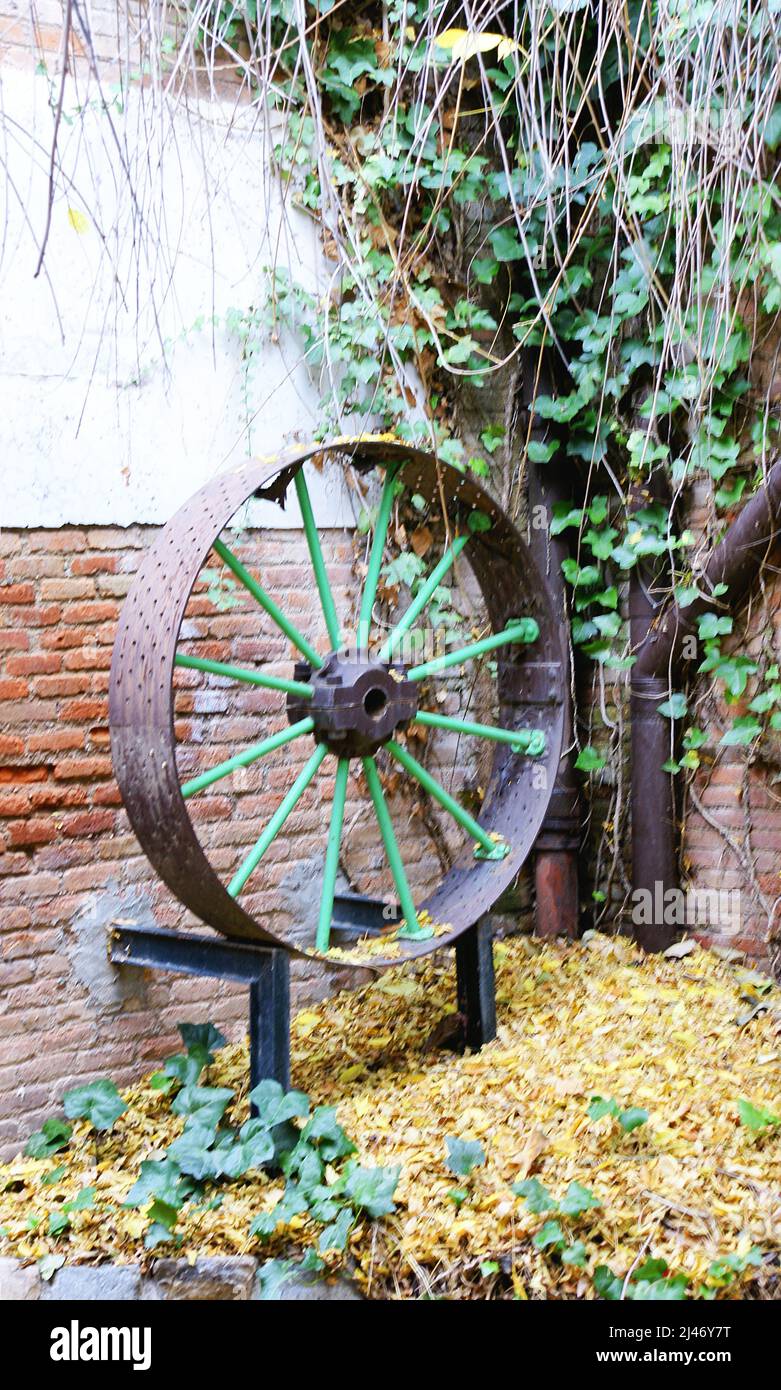Ornamental sculpture of a wheel in an old textile factory in Tarrasa ...
