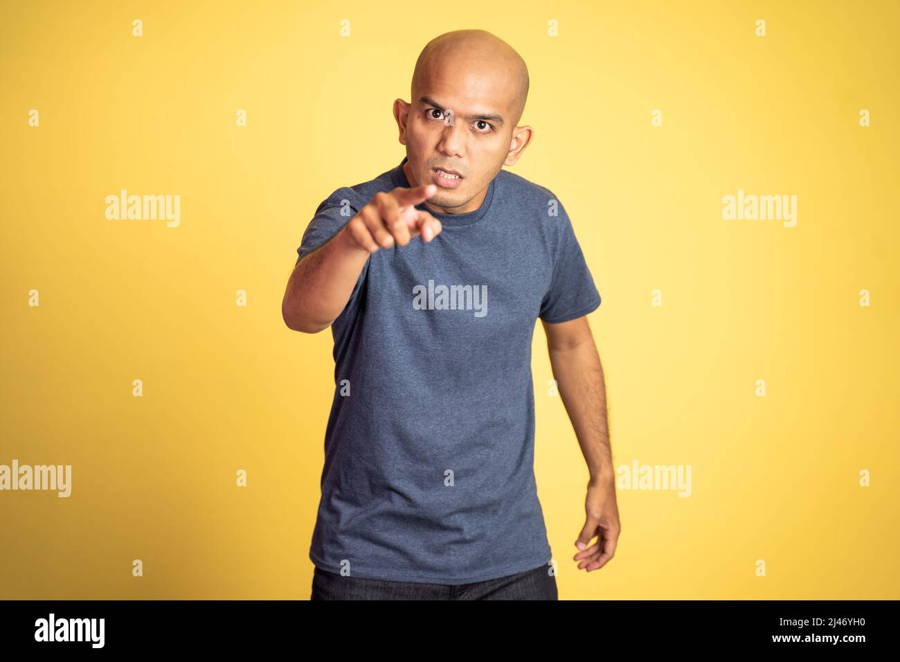 angry bald man with finger pointing forward to camera Stock Photo - Alamy