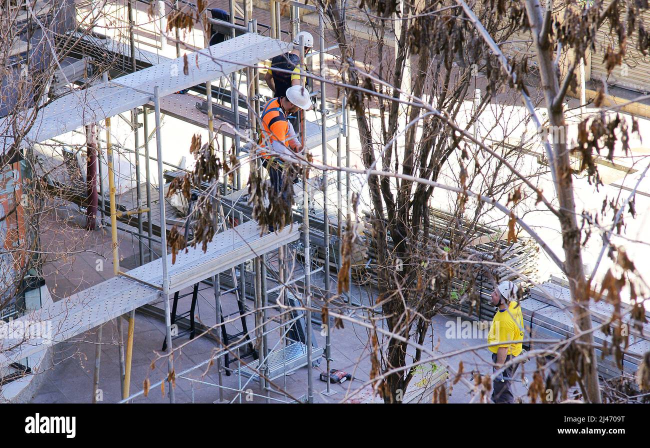 Workman working on the rehabilitation of the facade of a building in ...