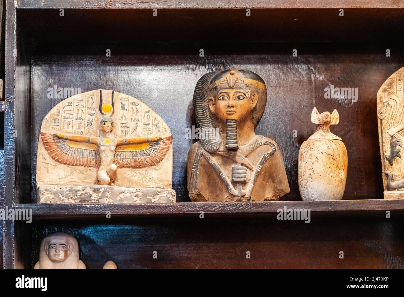 11 January 2022, Luxor, Egypt: Souvenir shop shelves with various goods for tourists in the ...