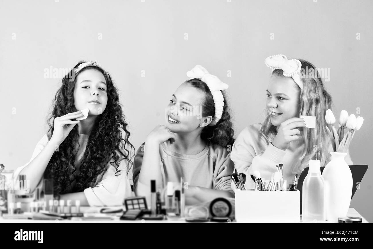 Young skin care. Beauty and fashion. Girls doing makeup together ...