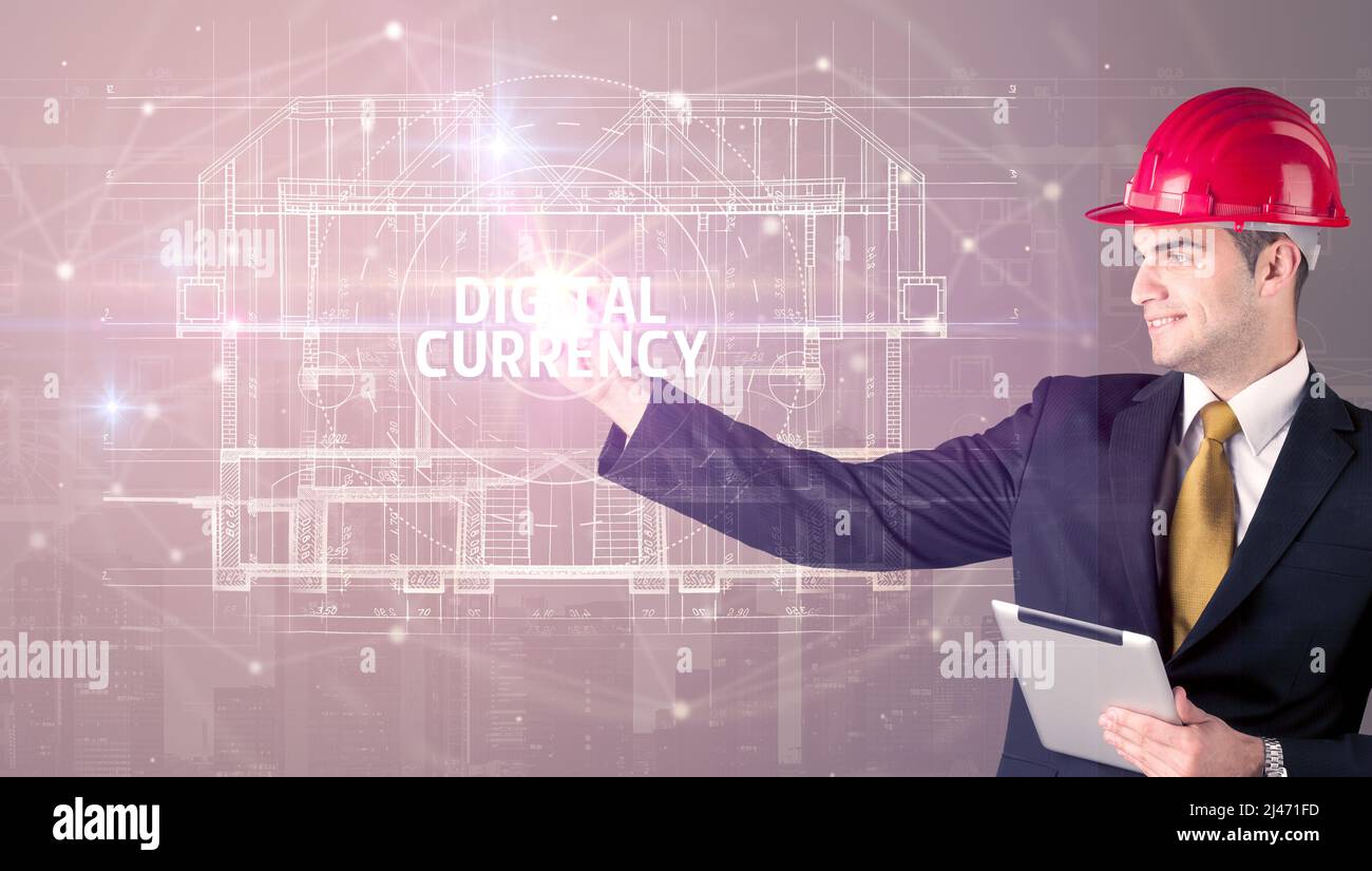 Handsome architect drawing with helmet Stock Photo - Alamy