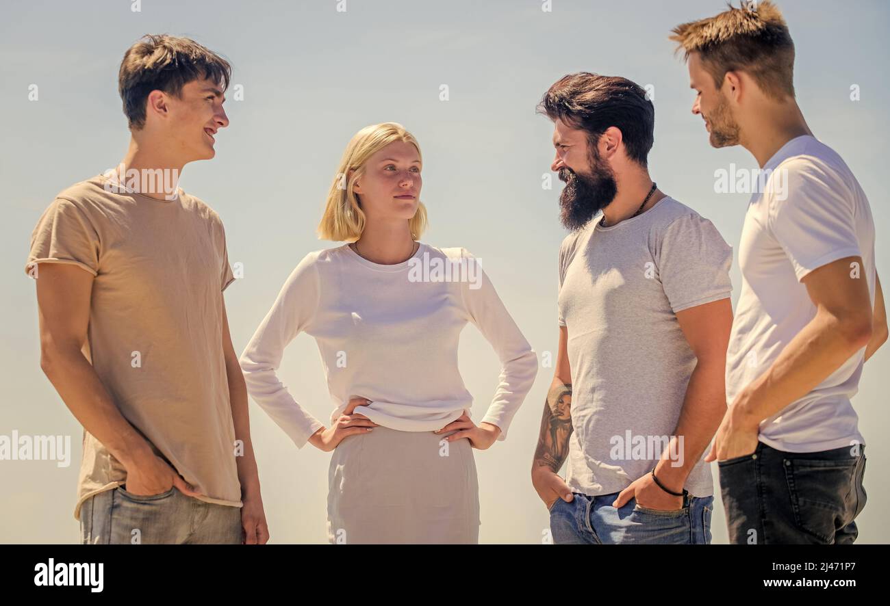 success is never easy. cheerful guys and girl. group of four people ...