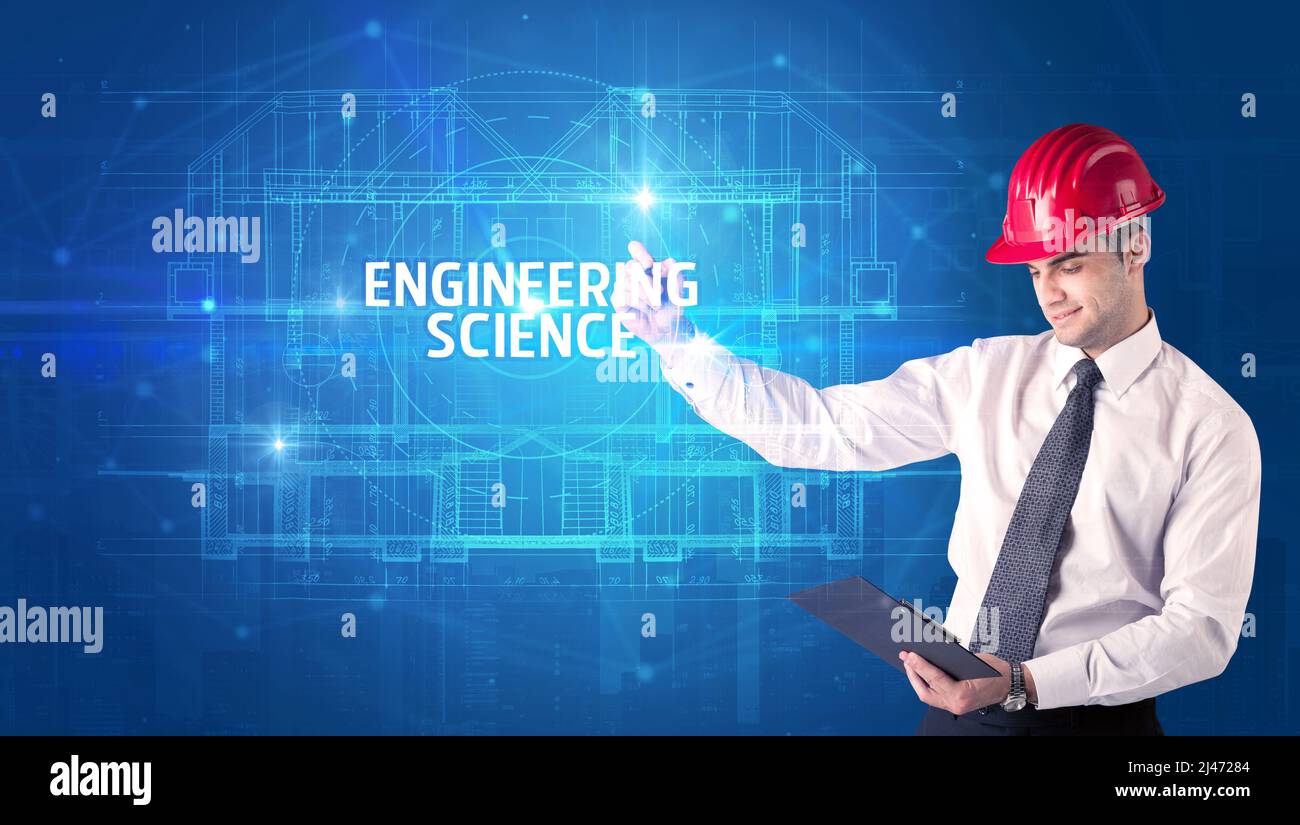 Handsome architect drawing with helmet Stock Photo - Alamy