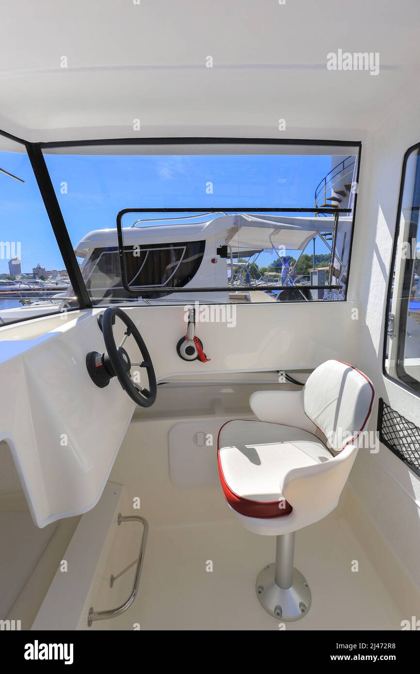 Cockpit modern motor boat with steering wheel and throttle control ...