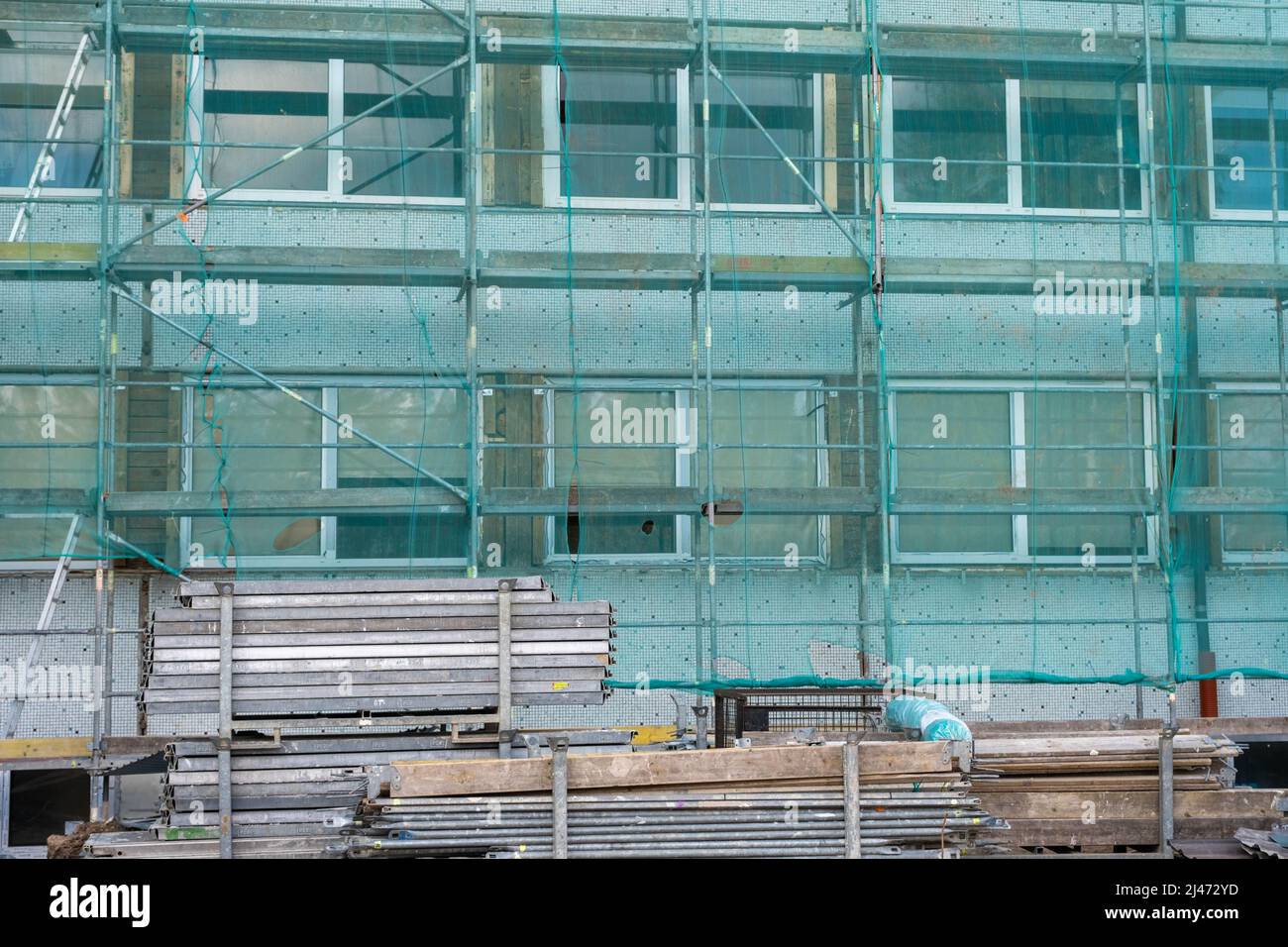 Building under construction wrapped green protection safety net Stock ...