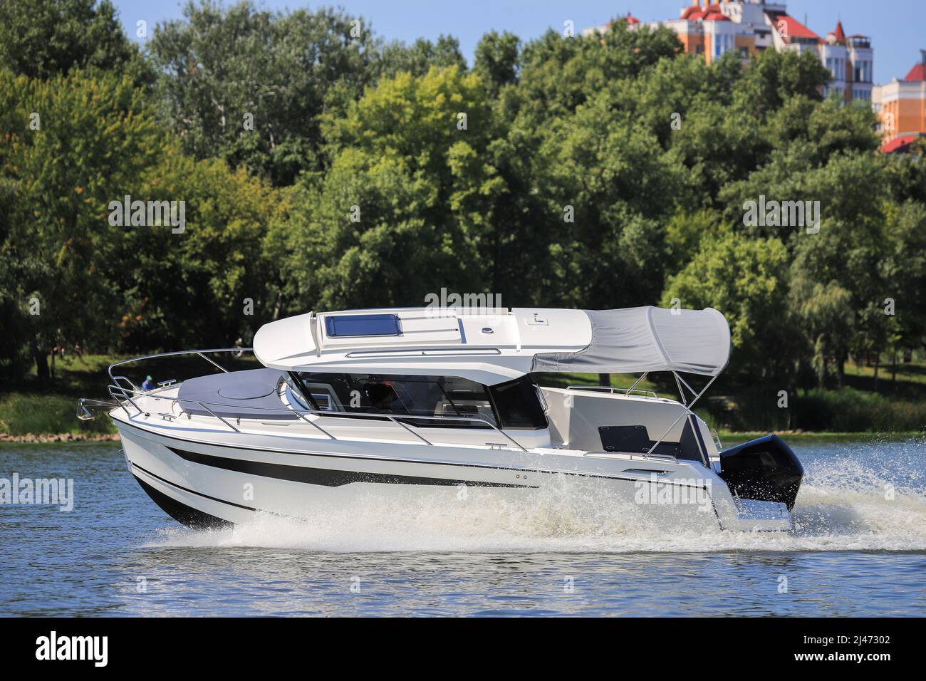 Luxury motor boat floating on the river Stock Photo - Alamy