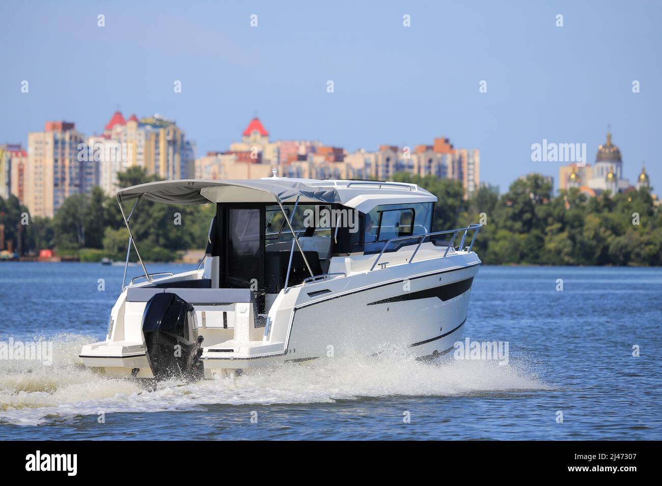 Luxury motor boat floating on the river Stock Photo - Alamy