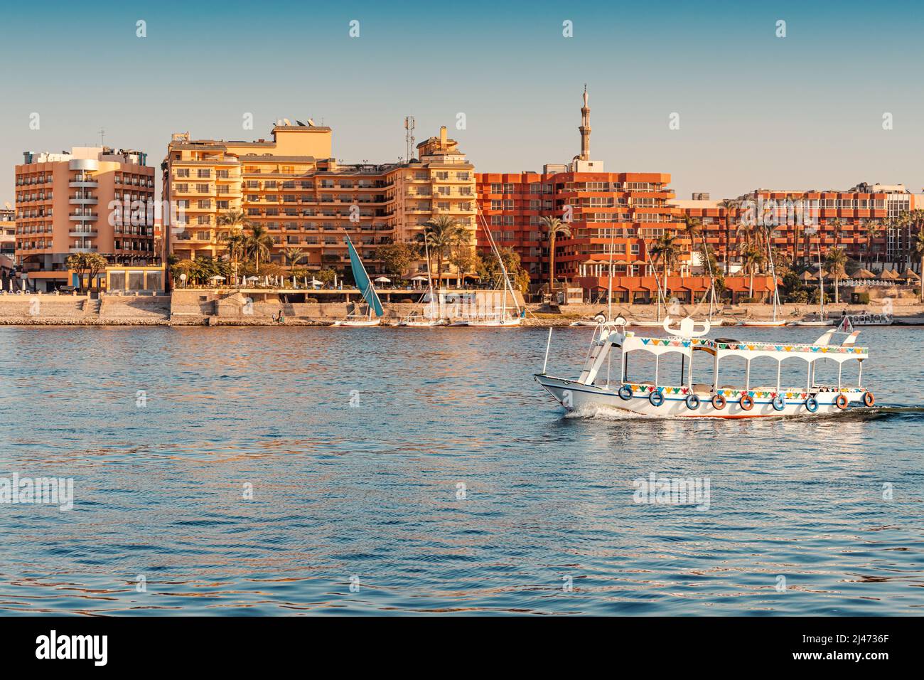 Traditional Egyptian ferry motor boat carry passengers from one bank of ...