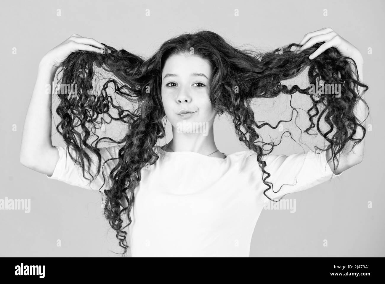 Long hair. Hairdresser salon. Adorable small child. Beautiful little ...