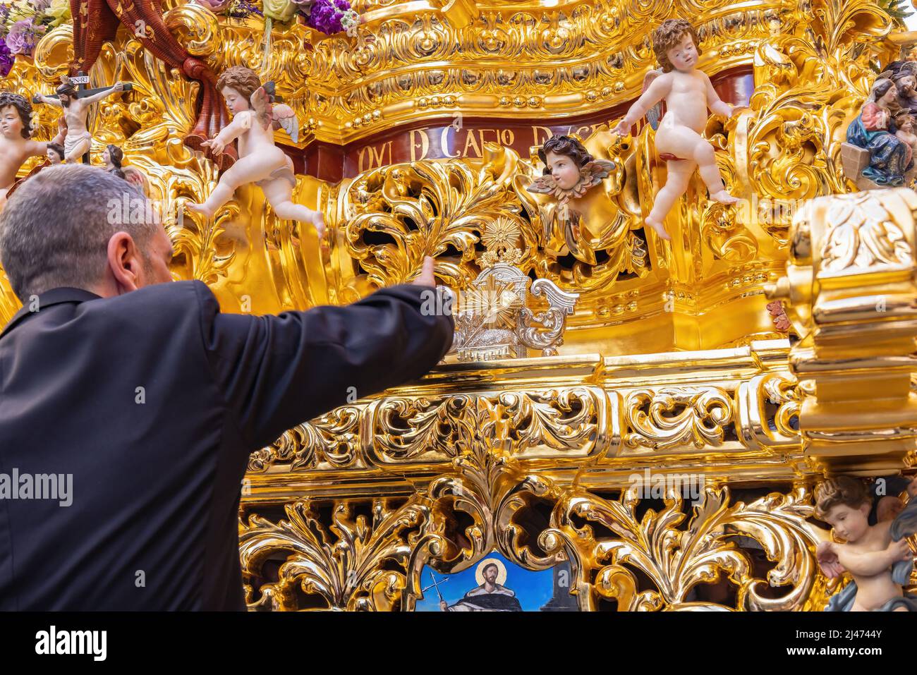 Huelva, Spain - April 10, 2022: Hand of the main brother (Hermano mayor ...