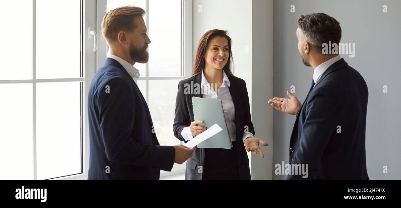 Team of happy, smiling friends and colleagues standing in the office ...