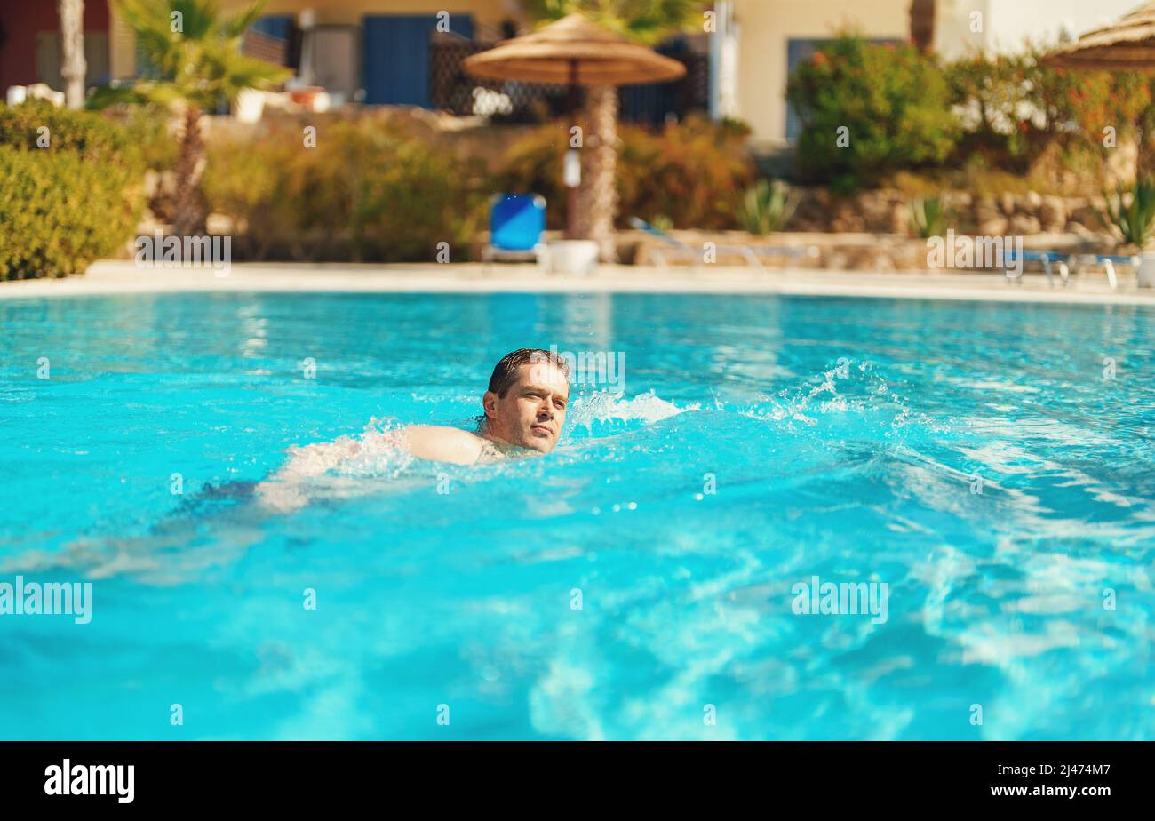 Action man in swimming pool hi-res stock photography and images - Alamy