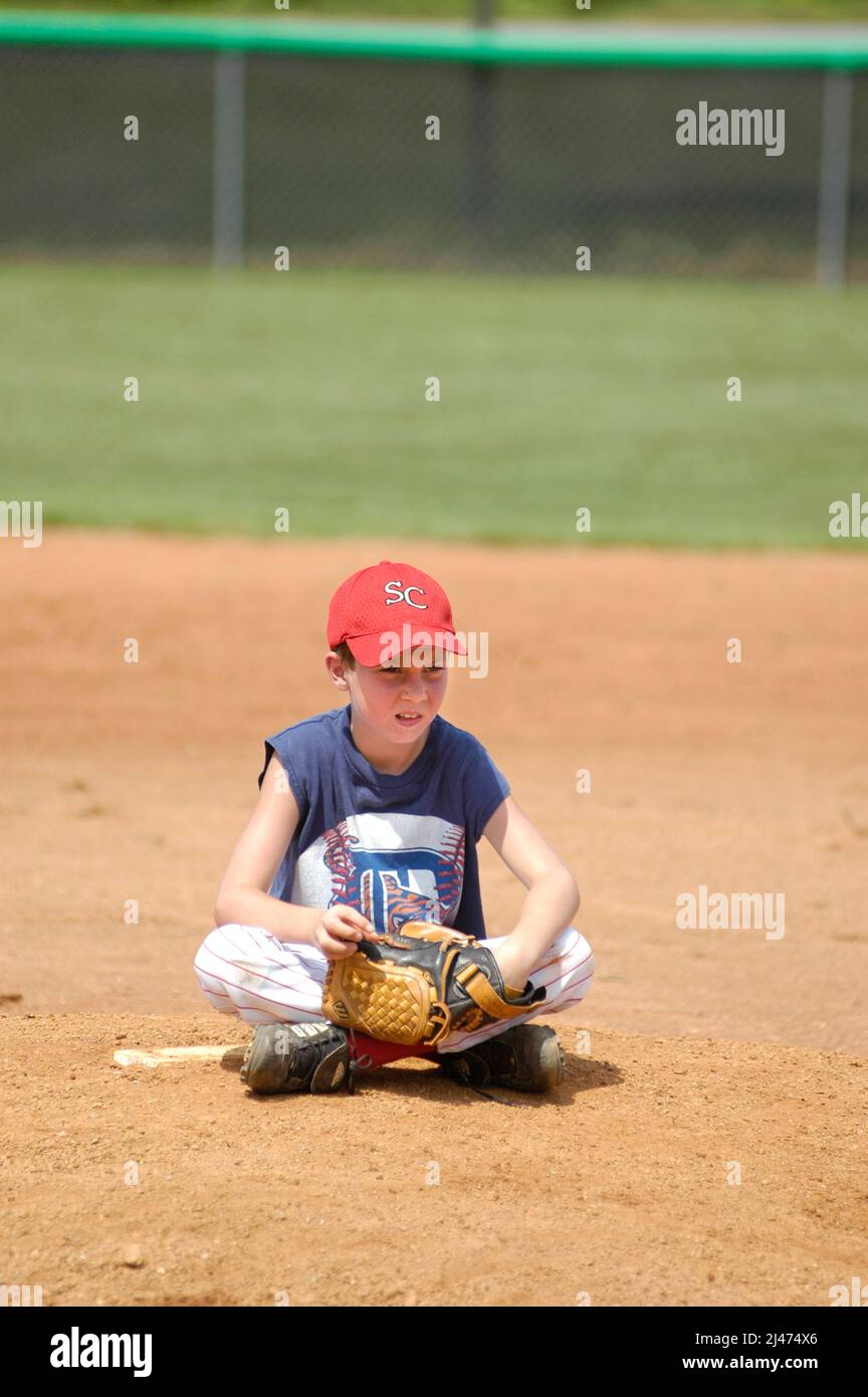 Young boys playing baseball on ball field, Pitcher, Catcher, Hitter and ...
