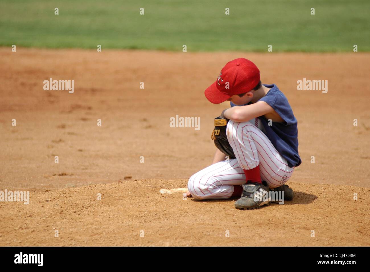 Young boys playing baseball on ball field, Pitcher, Catcher, Hitter and ...