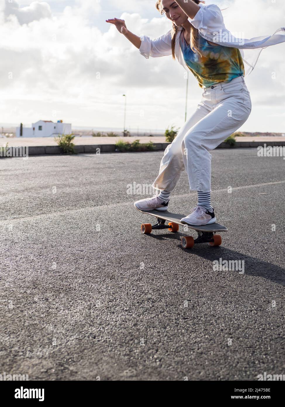 Skater young woman sliding on the street Stock Photo - Alamy