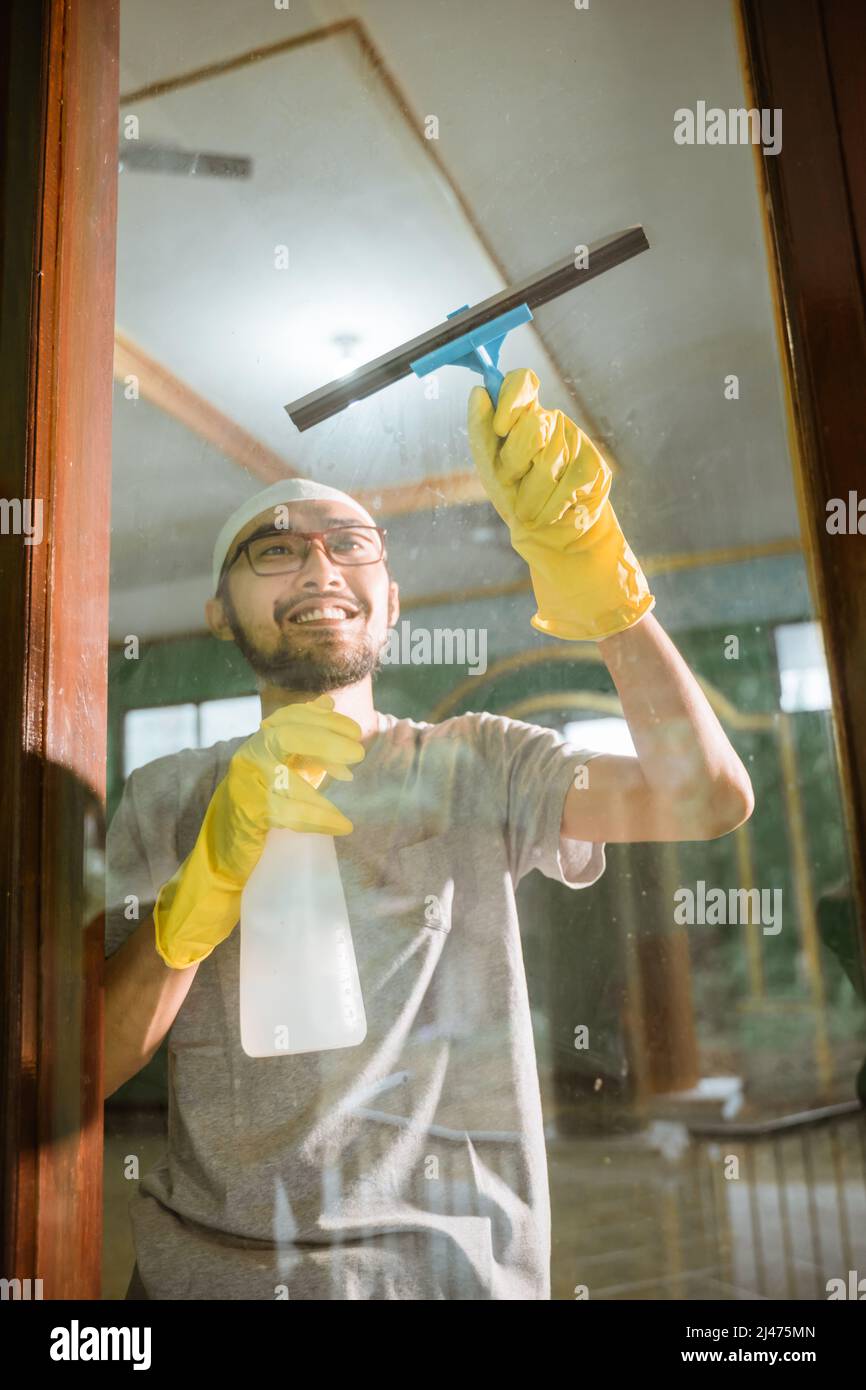 muslim young male cleaning the mosque before praying Stock Photo - Alamy