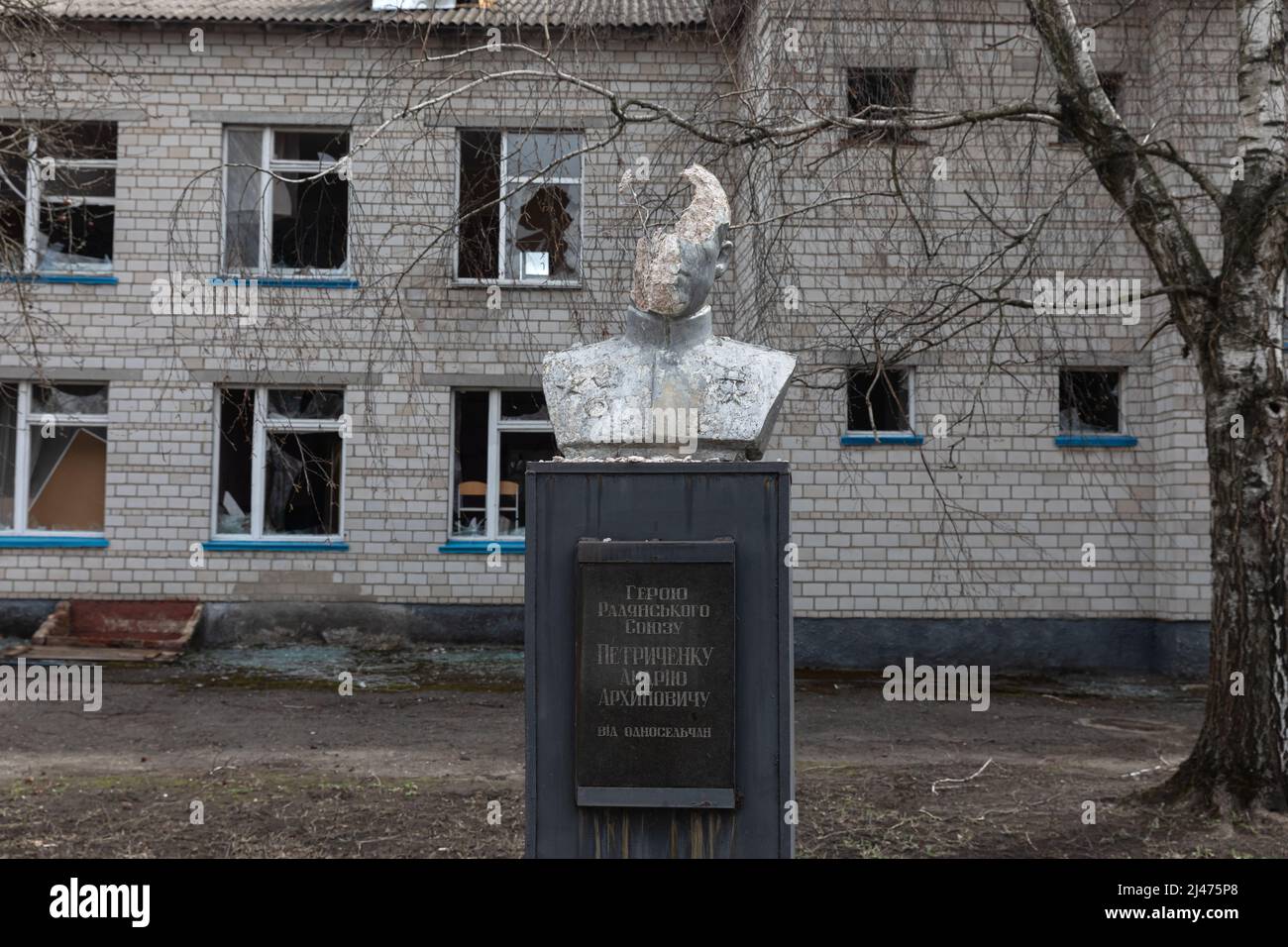 ANDRIIVKA, UKRAINE - Apr. 12, 2022: Damaged monument to the hero of the ...