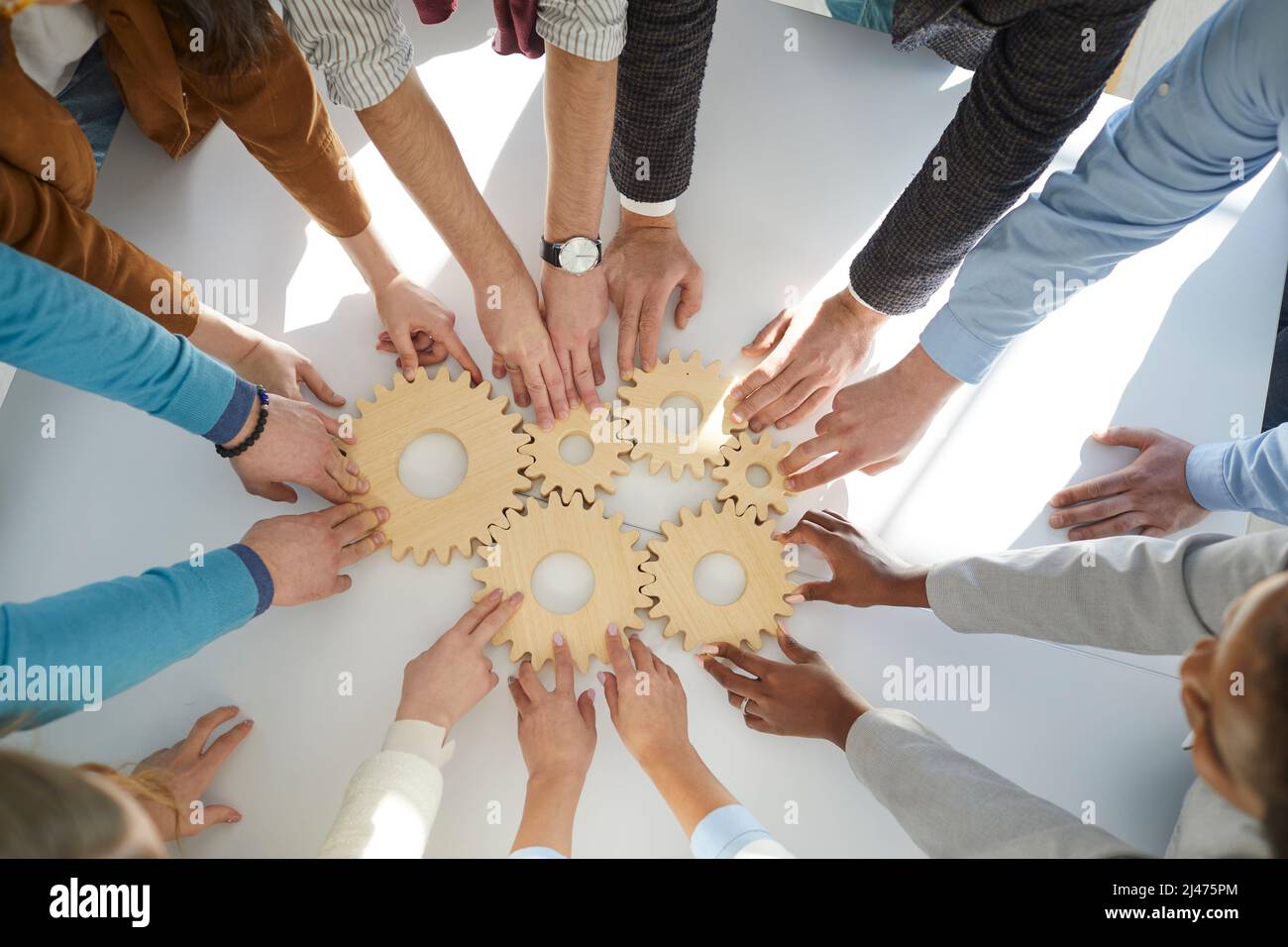 Top view of employees connect wheel gears Stock Photo - Alamy