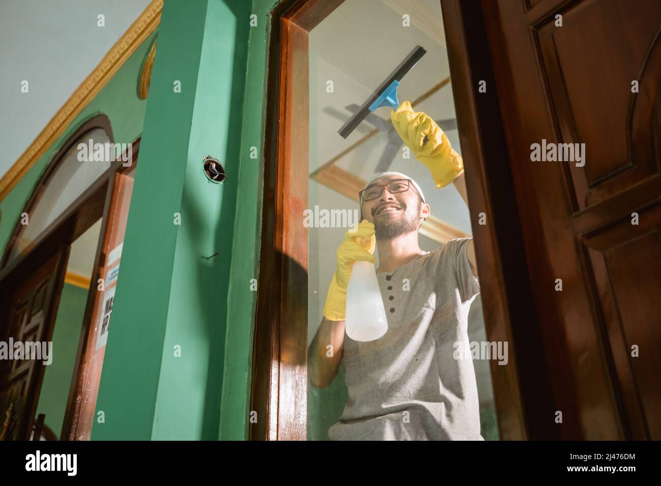muslim young male cleaning the mosque before praying Stock Photo - Alamy