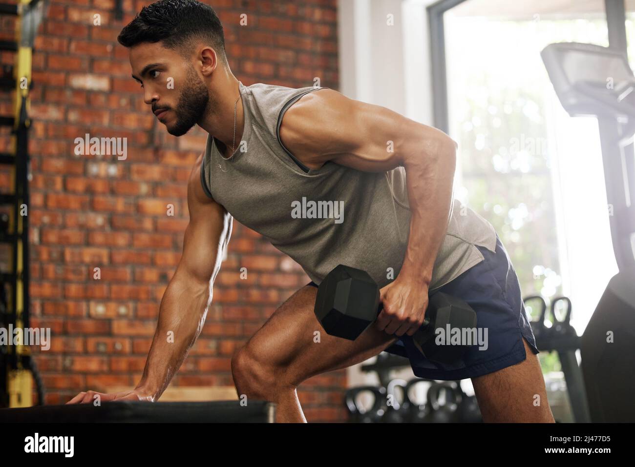 Man works out in gym hi-res stock photography and images - Alamy
