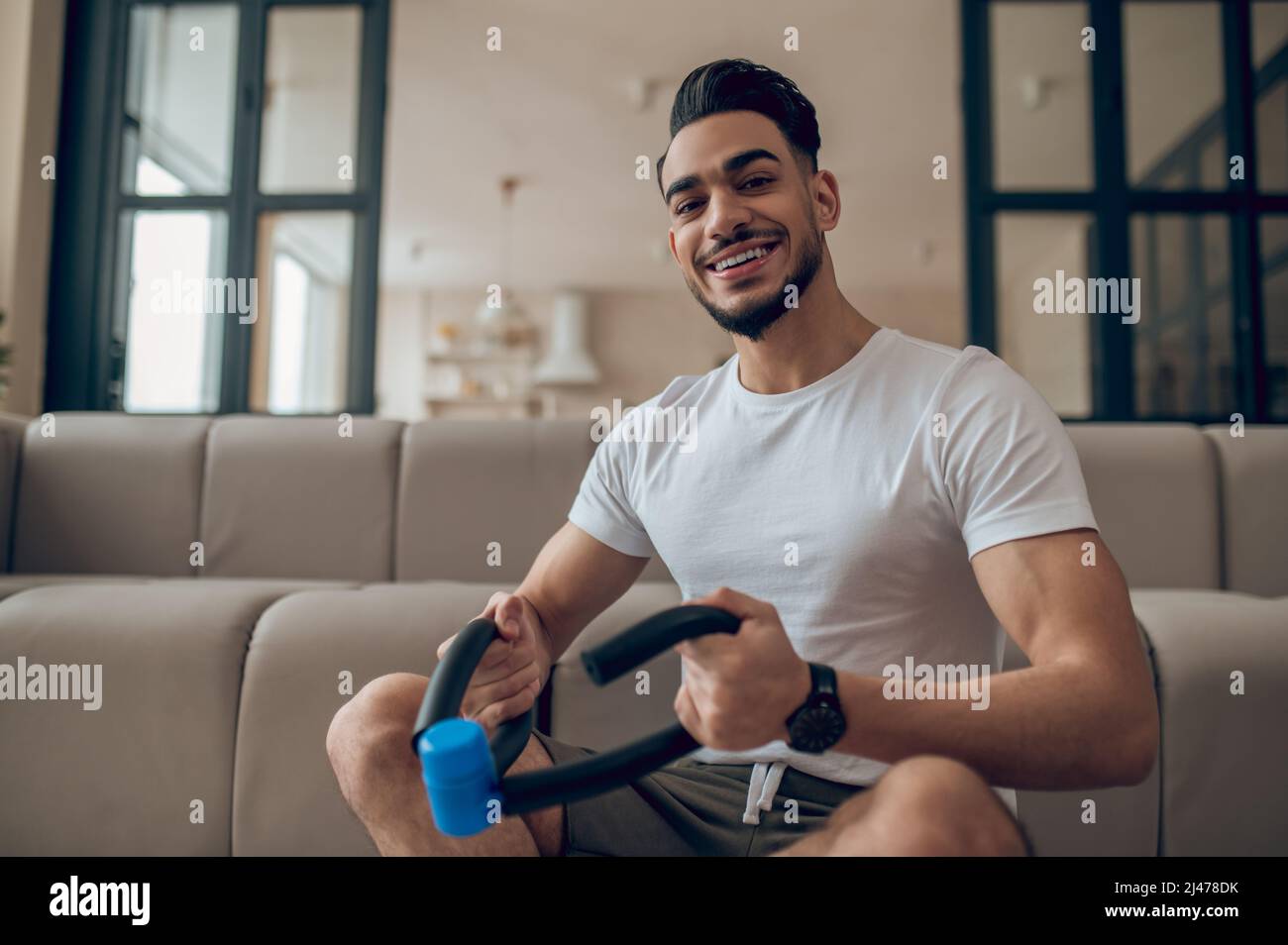 Young man exercising expander hi-res stock photography and images - Alamy