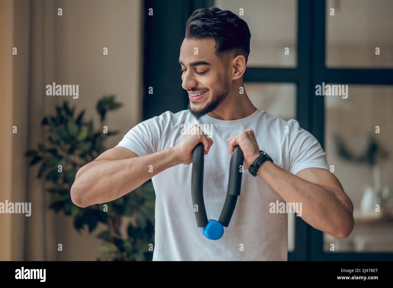 Young man exercising expander hi-res stock photography and images - Alamy