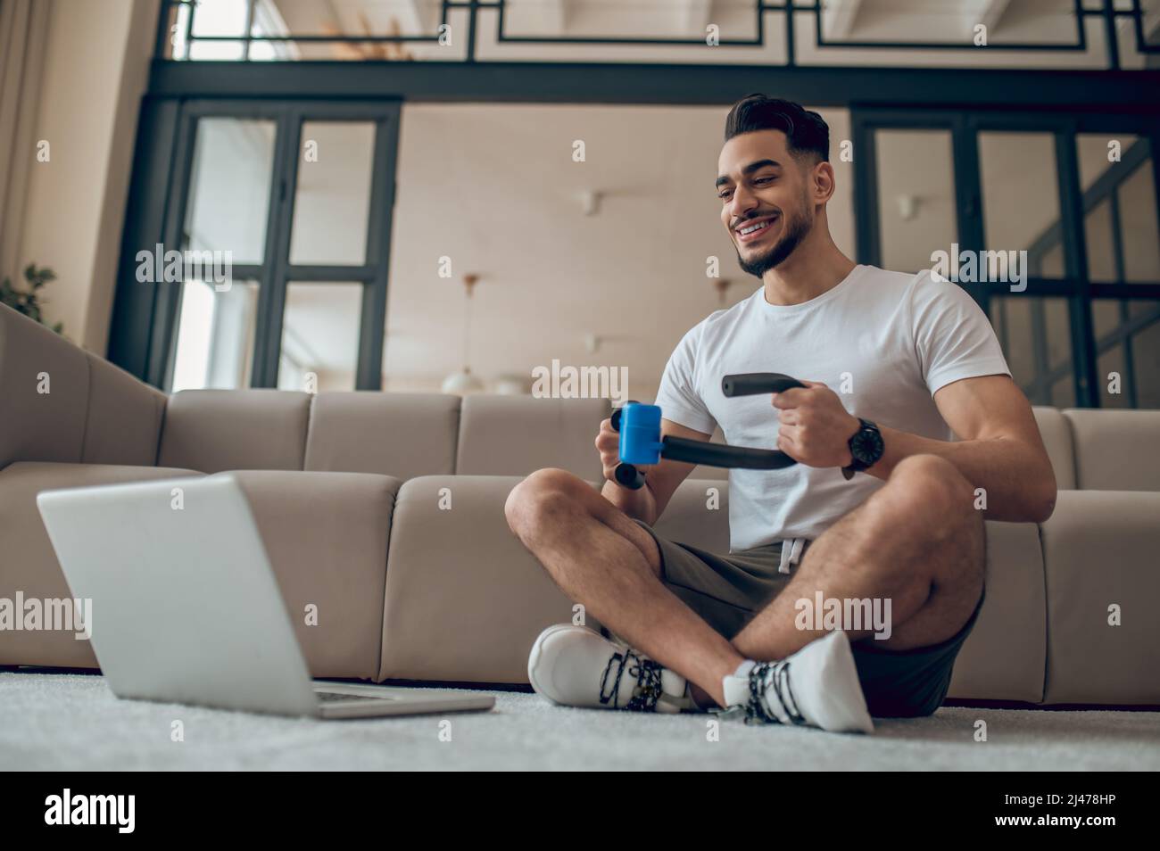 Young man exercising expander hi-res stock photography and images - Alamy