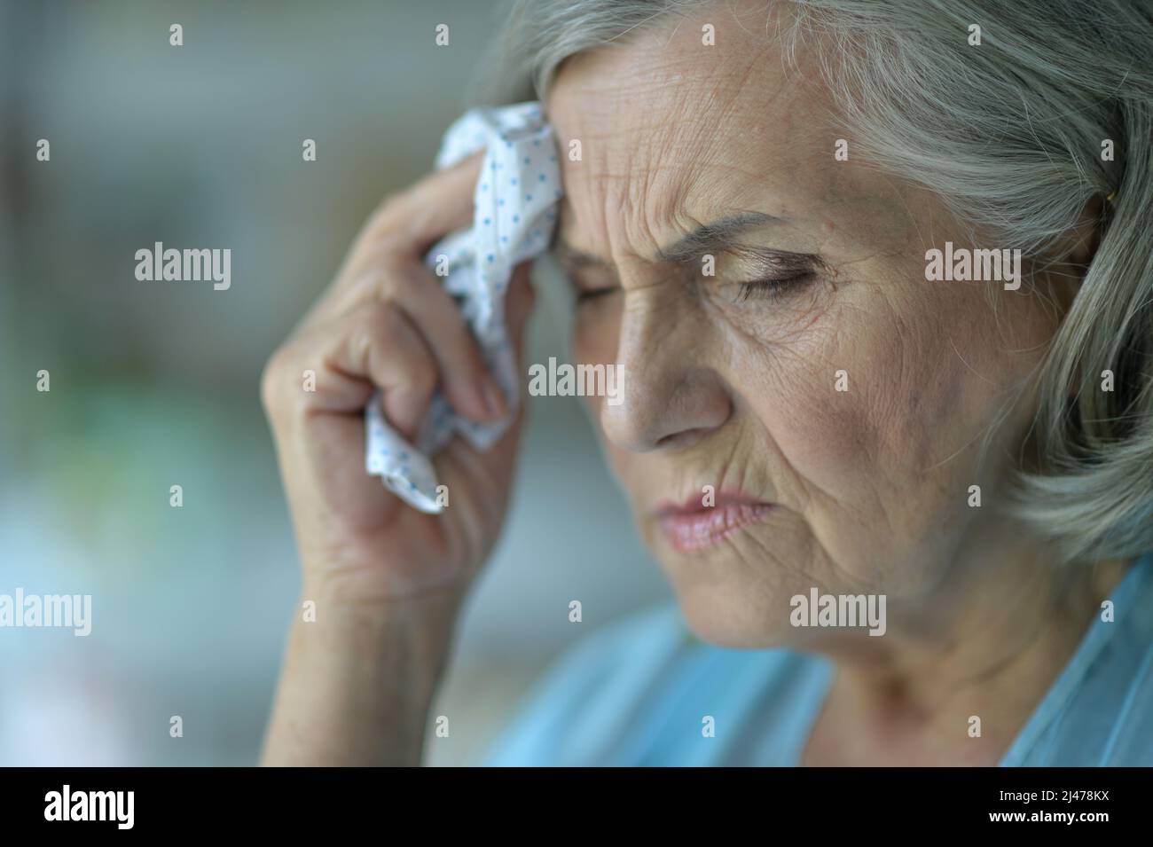 Close up portrait of sick senior woman Stock Photo - Alamy