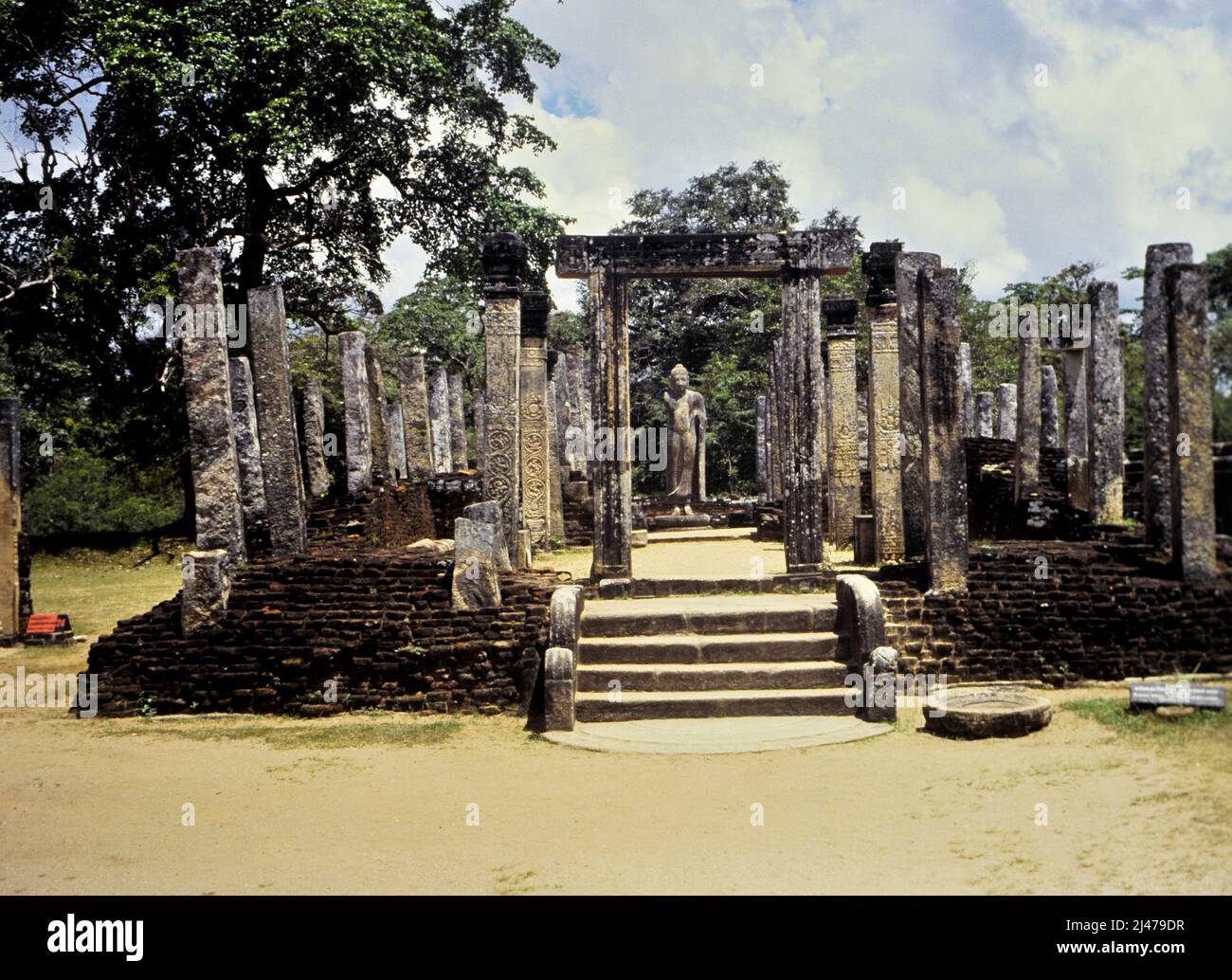 old stone ruins, columns and Buddha in park in India Stock Photo - Alamy