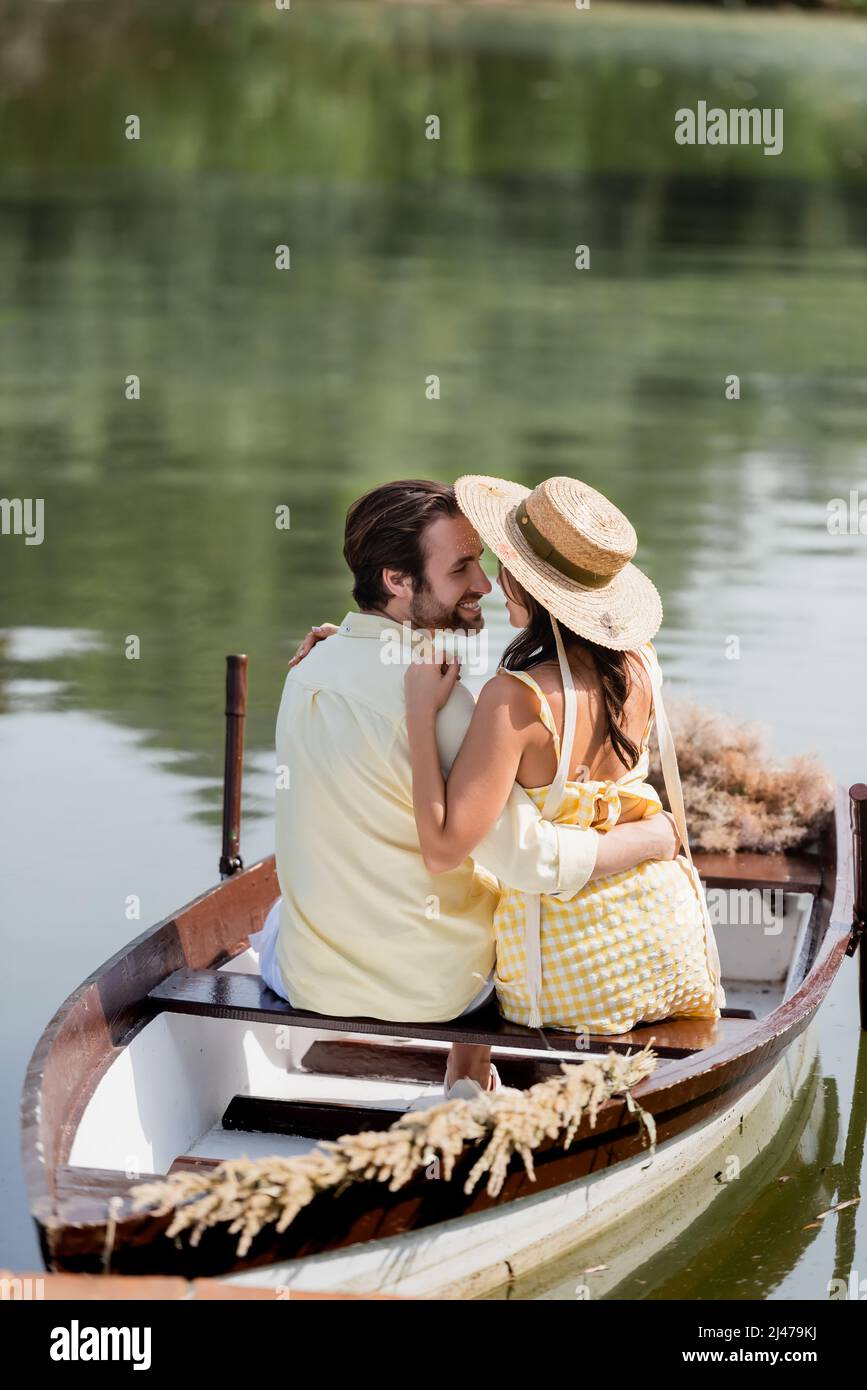happy young couple hugging during romantic boat ride Stock Photo - Alamy
