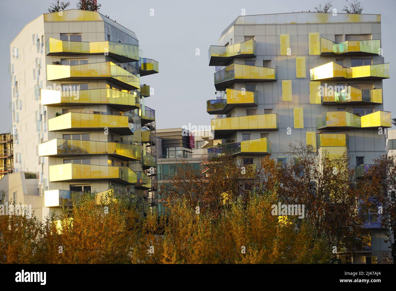 view of high rise buildings with sun reflecting on glass decks in ...
