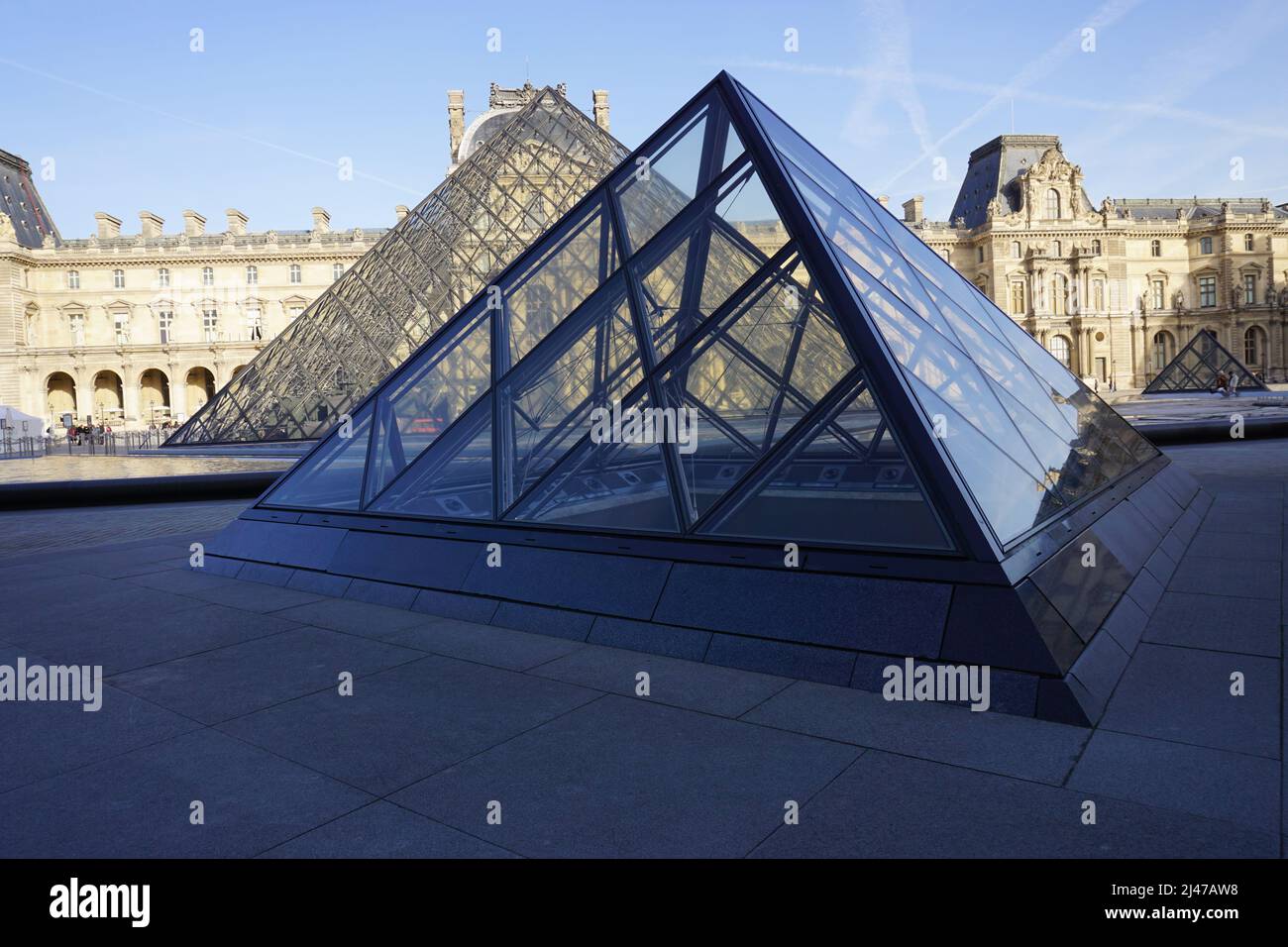 view the glass pyramids in front of the Louvre museum in downtown Paris ...