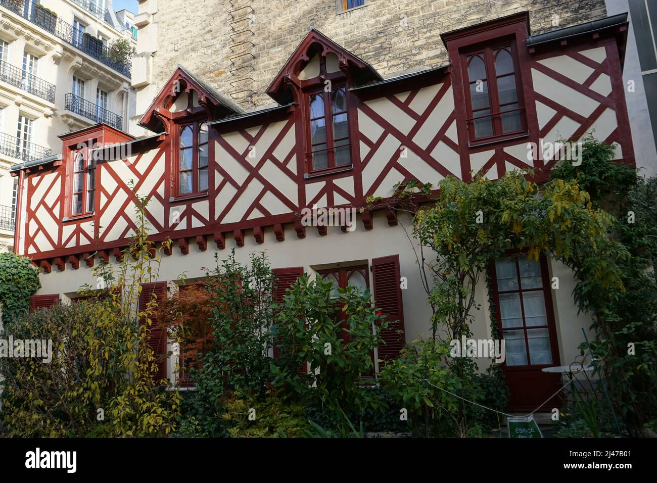 view of a half timbered red building in downtown Paris, France Stock ...