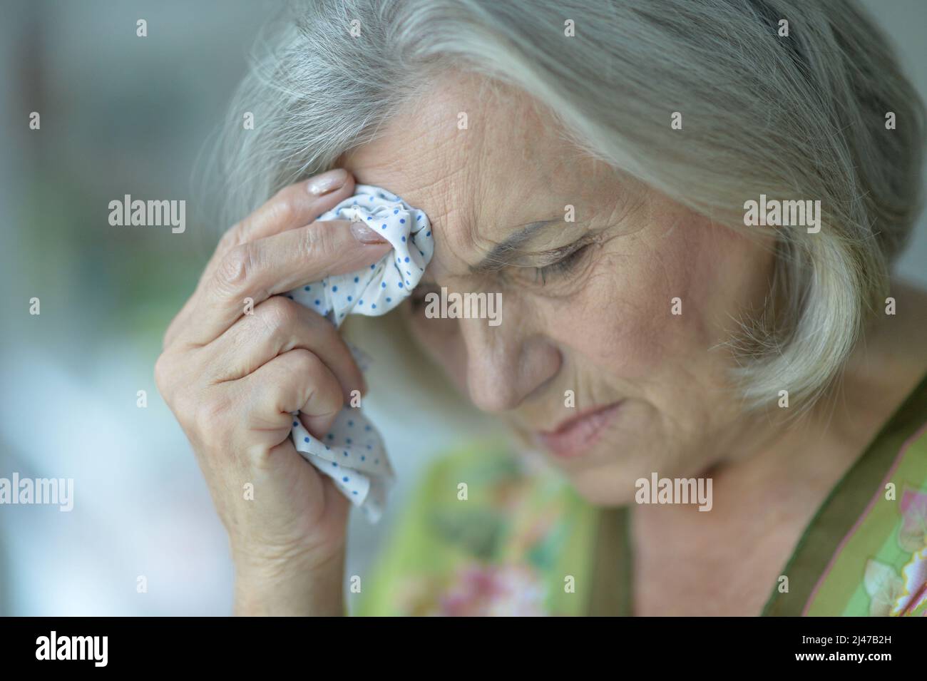 Close up portrait of sick senior woman Stock Photo - Alamy