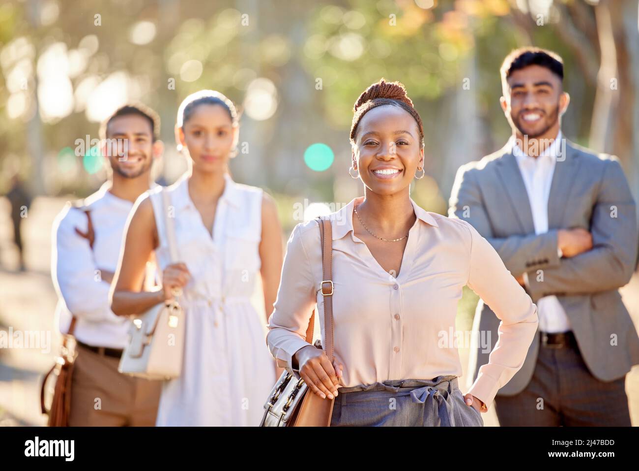 Work week is done, time for the weekend. Shot of a diverse group of businesspeople standing ...