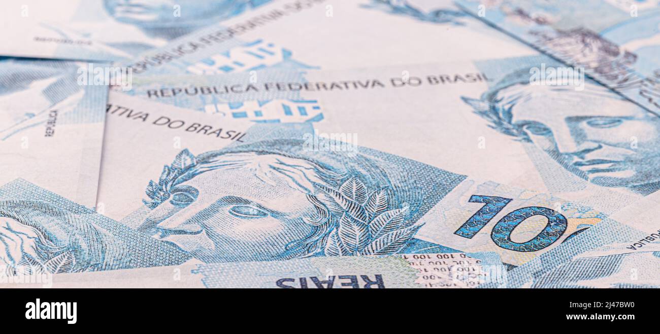 various 100 reais banknotes from brazil, brazilian money on background ...