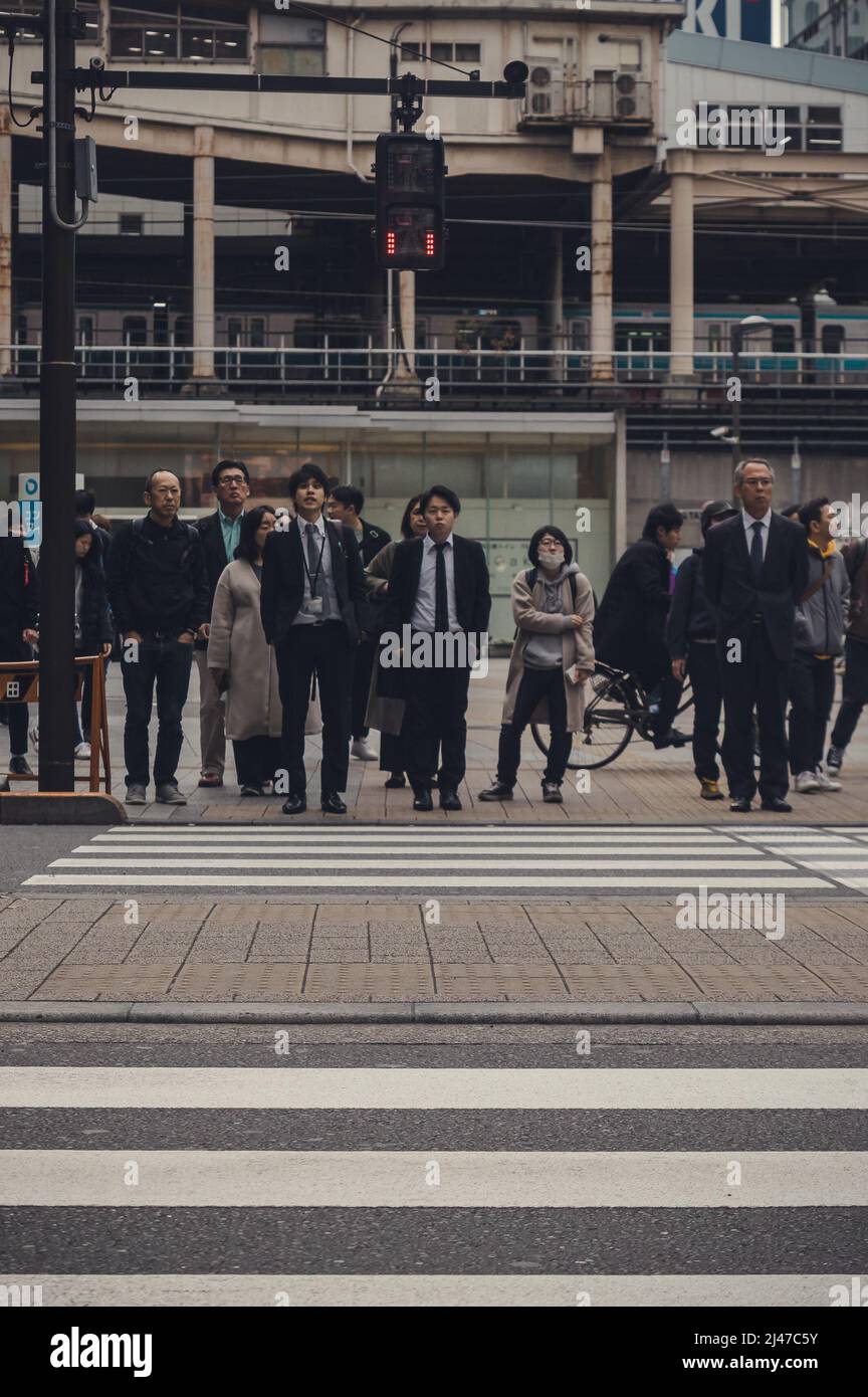 asian office workers waiting for traffic light Stock Photo - Alamy
