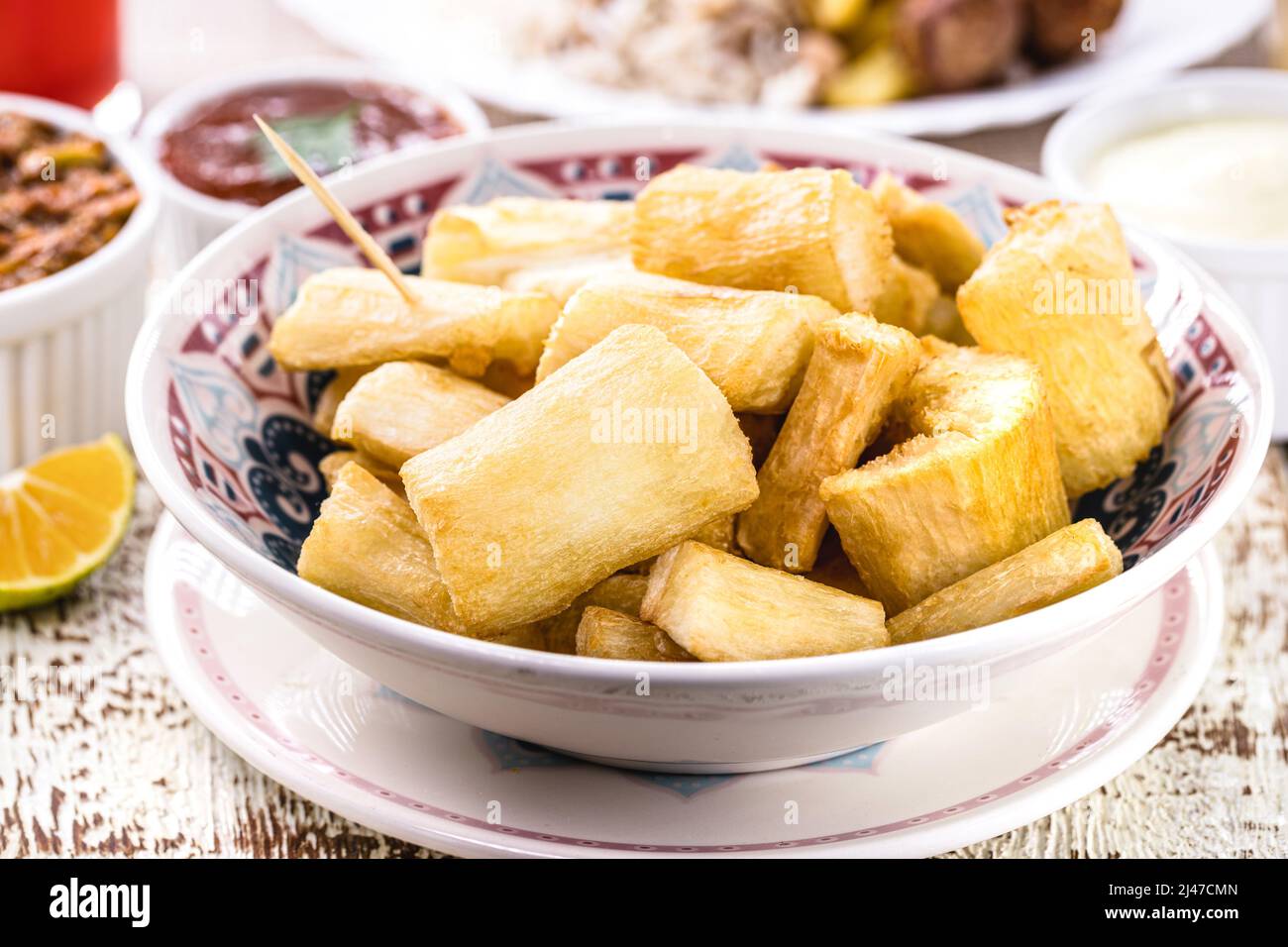 fried sweet cassava, served with vegetables and spices, typical ...