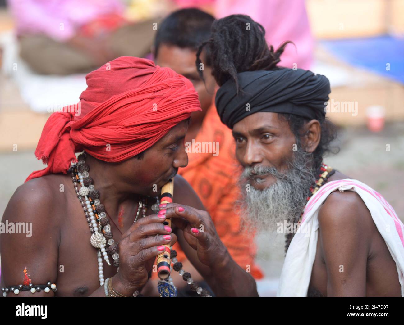 Holy people dancing to a different folk music at the temple during ...