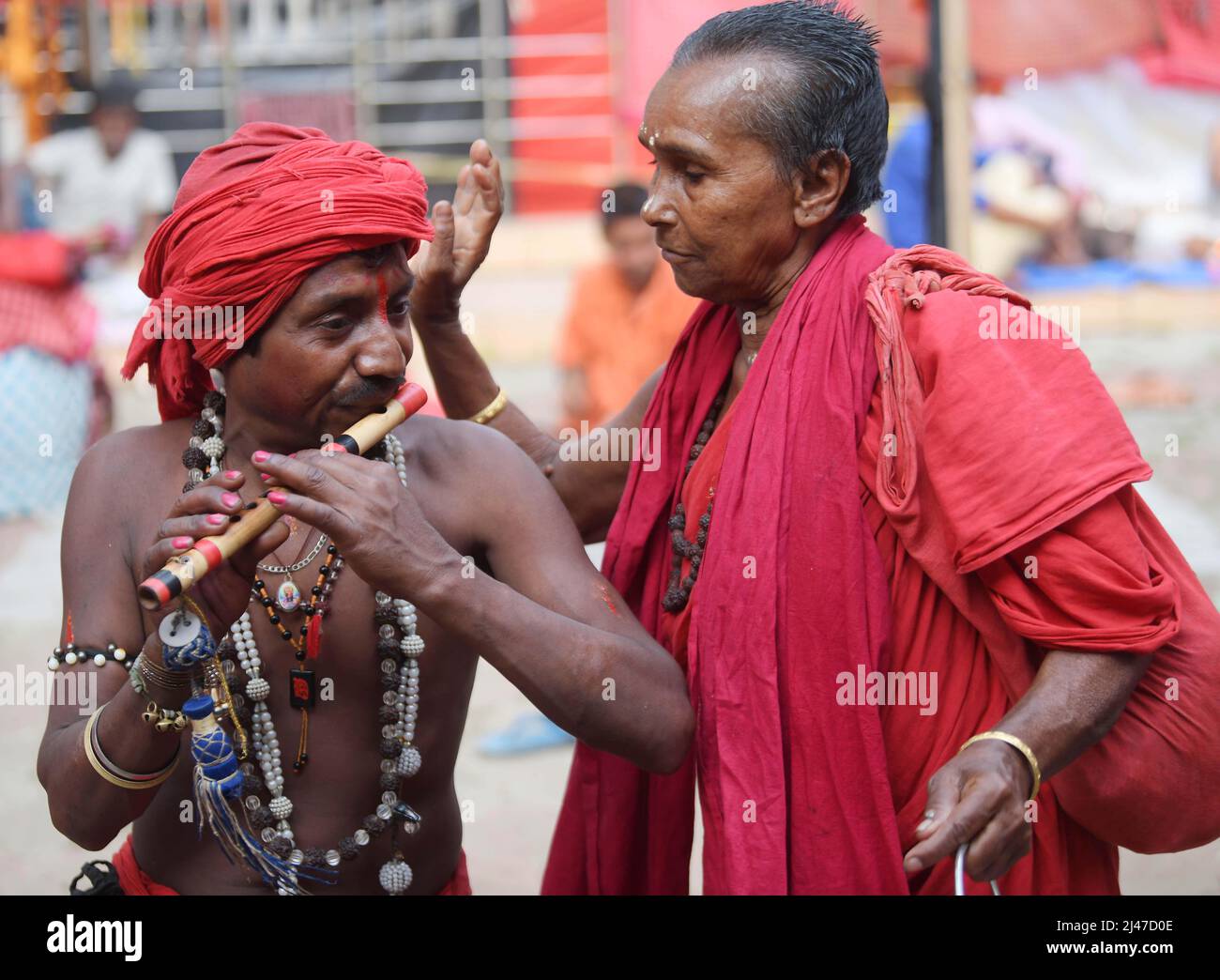 Holy people dancing to a different folk music at the temple during ...